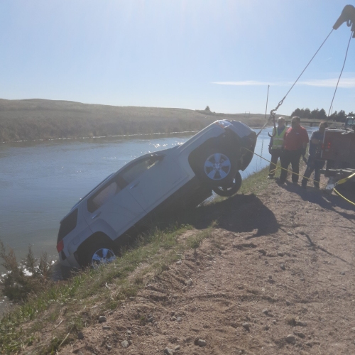 Mother and son rescued from sinking SUV - KBEAR 92.3
