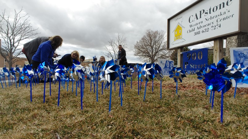 Blue Pinwheels, Lights Marking Child Abuse Prevention Month