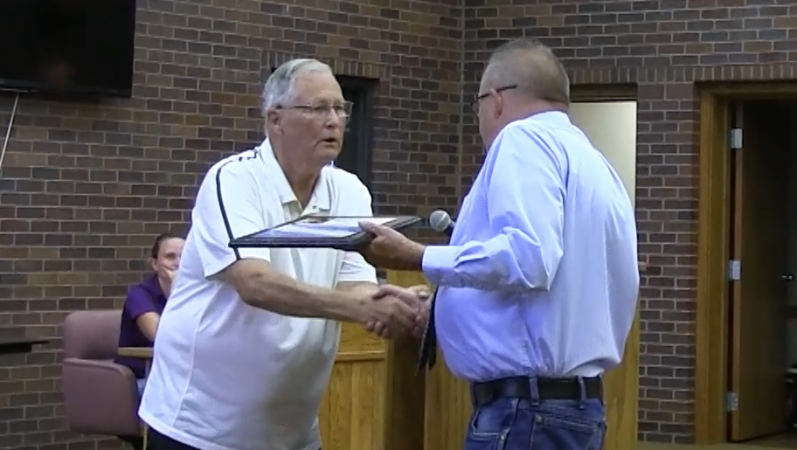Plaque honoring fallen Gering Police officer presented to the City